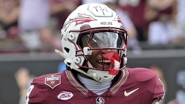 FSU football speedster Micahi Danzy breaks the rock after running by ...