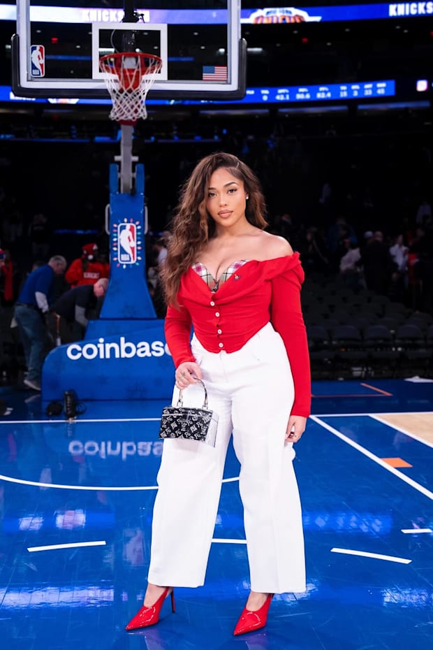 Knicks WAG gf Jordyn Woods flexes Yankees cap, $7.2k Louis Vuitton ...