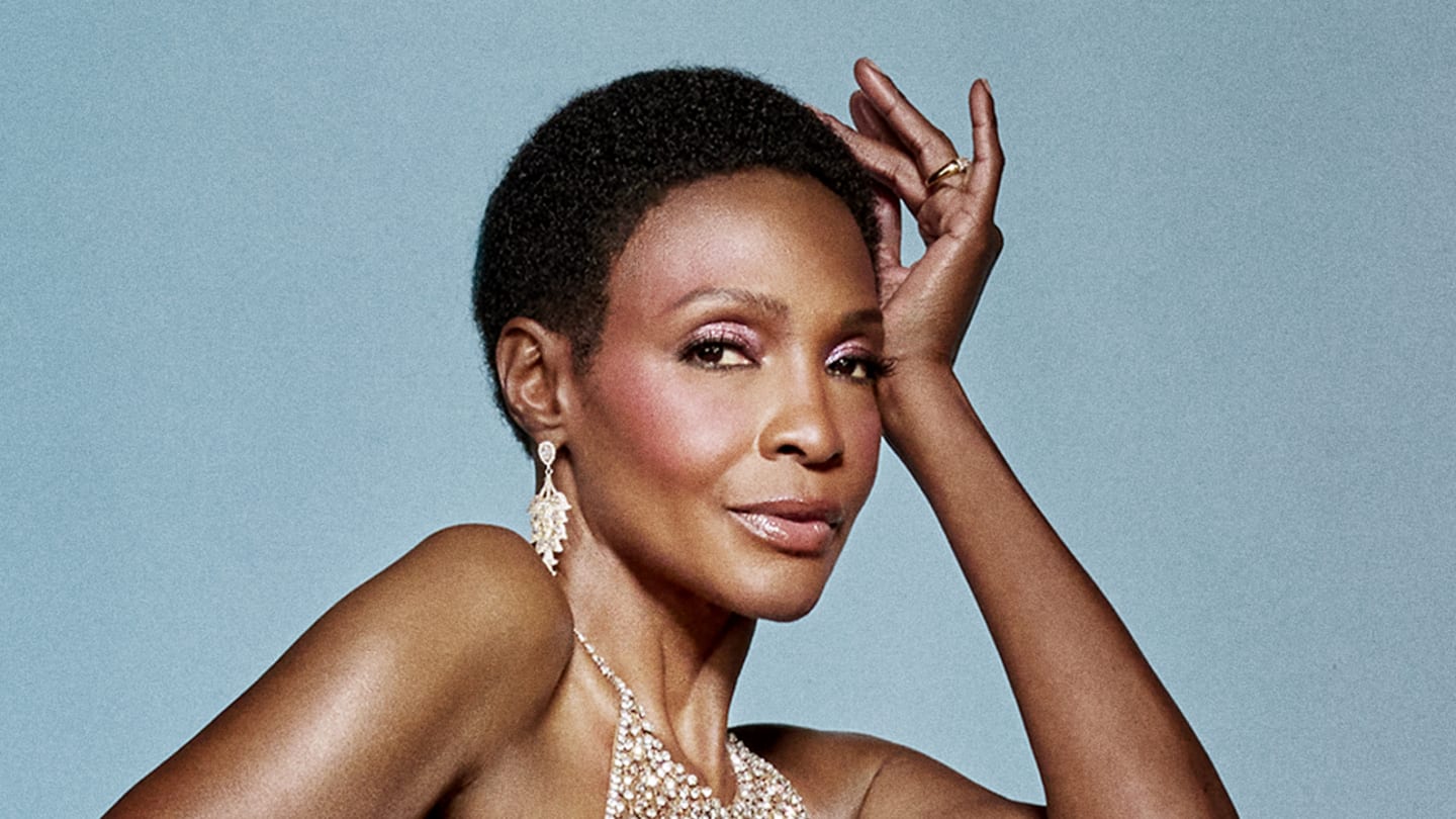 Roshumba Williams Poses With Her SI Swimsuit Cover in Little White Two ...