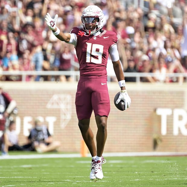 FSU football speedster Micahi Danzy breaks the rock after running by Kent State