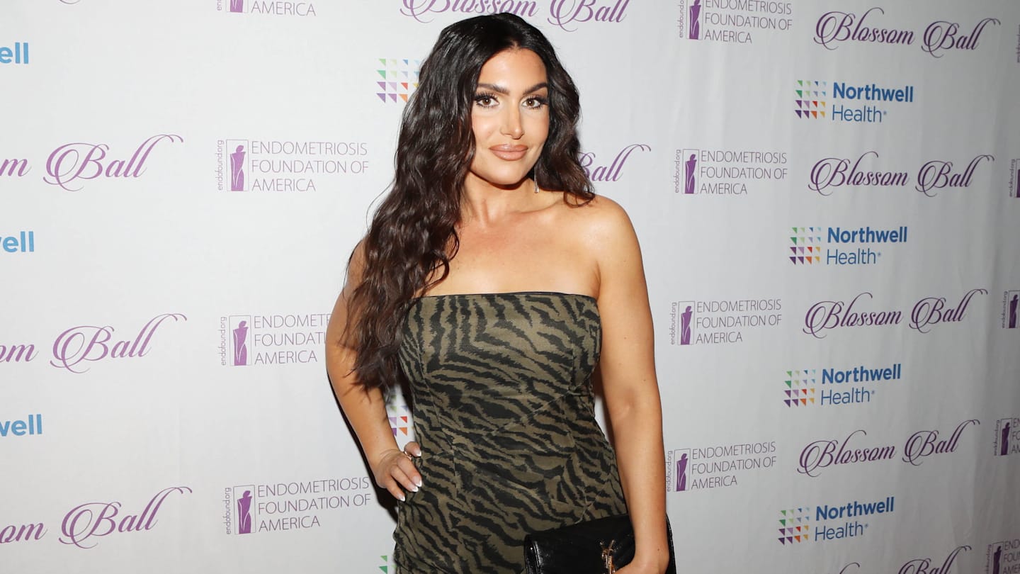 ESPN’s Molly Qerim crushes in blue all-leather fit, white boots outside