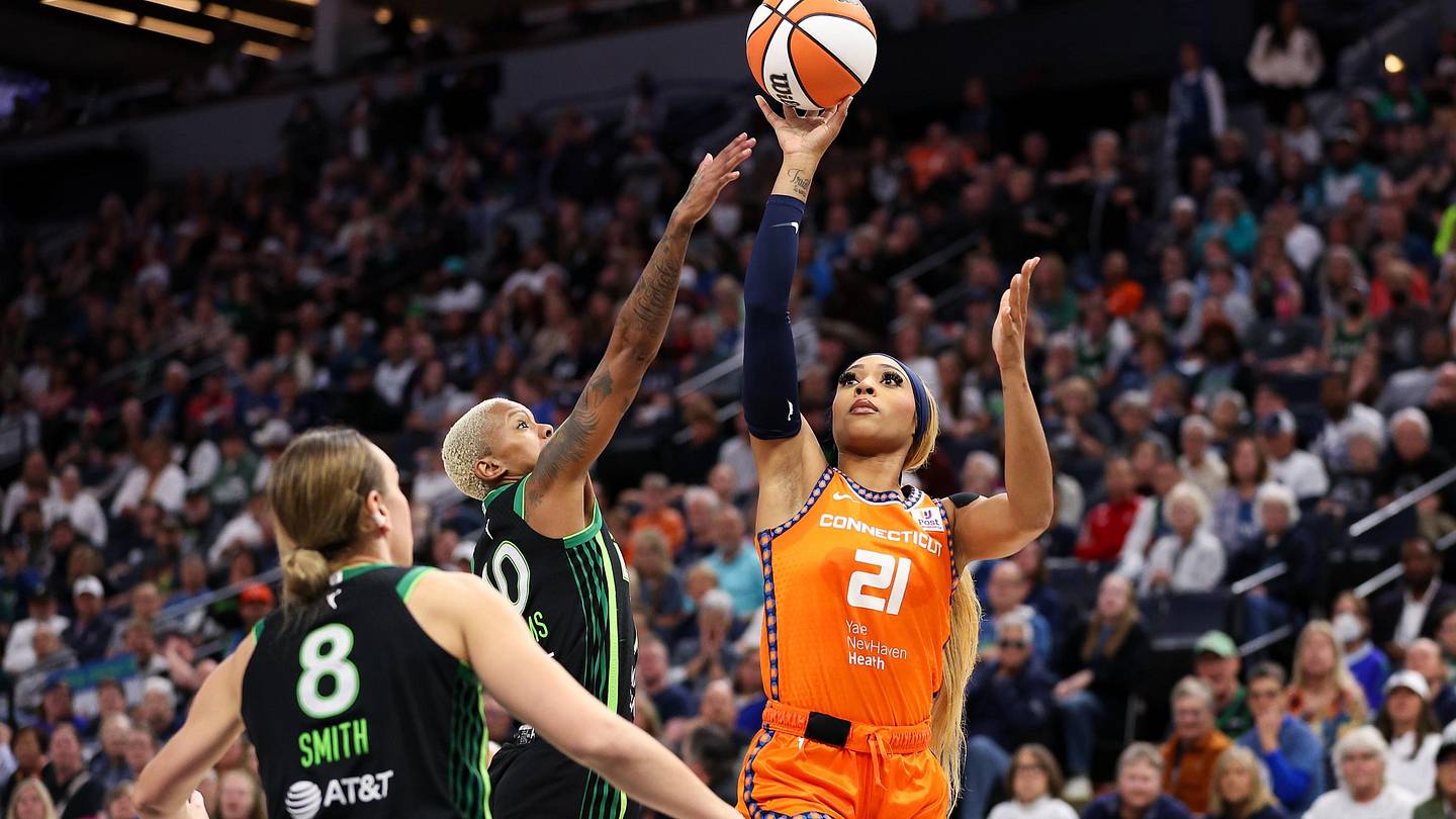 DiJonai Carrington rocks ‘Juicy” crop top, pop star velour WNBA playoff fit