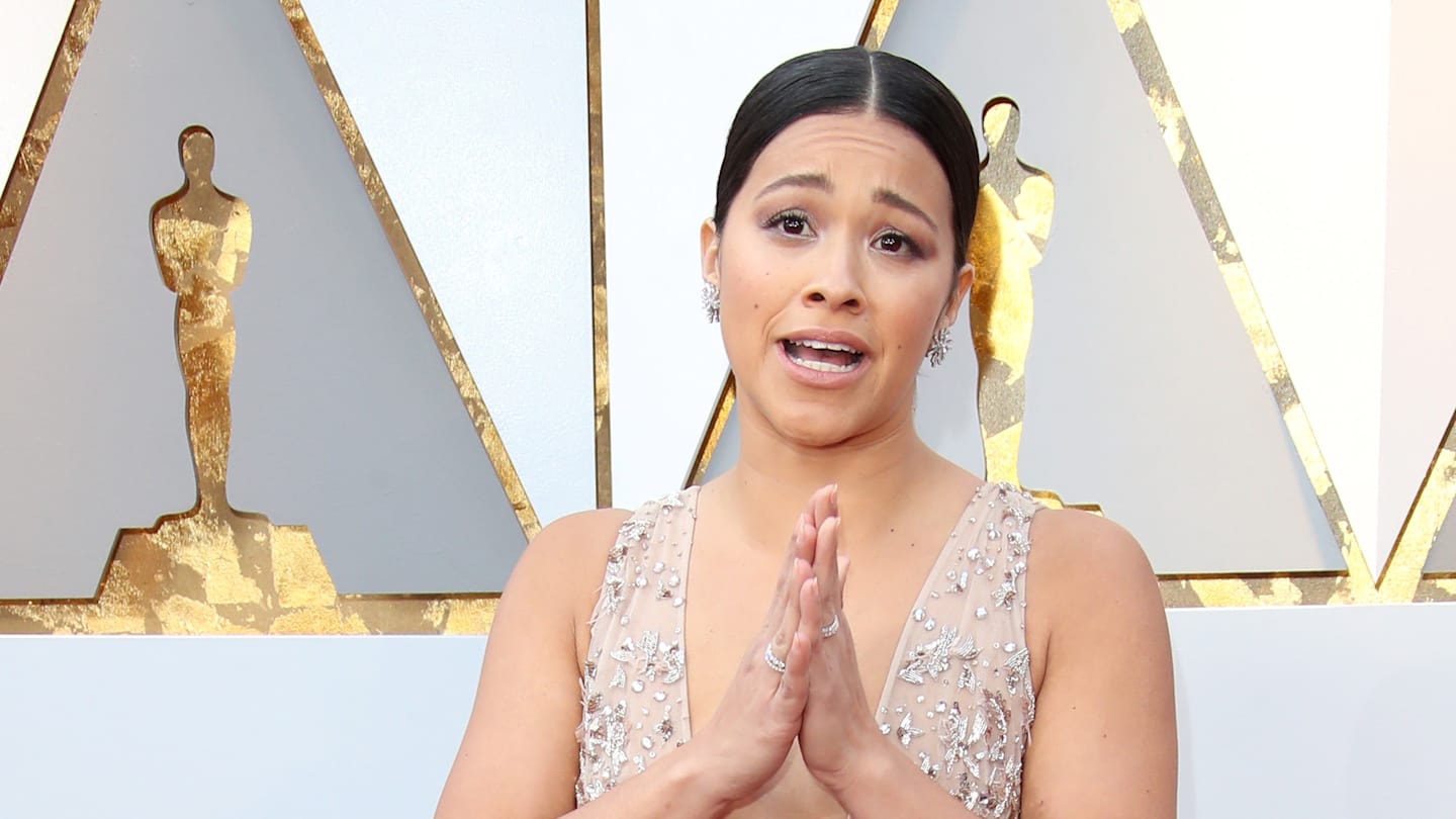 Pregnant Gina Rodriguez cradles baby bump in maternity photo shoot