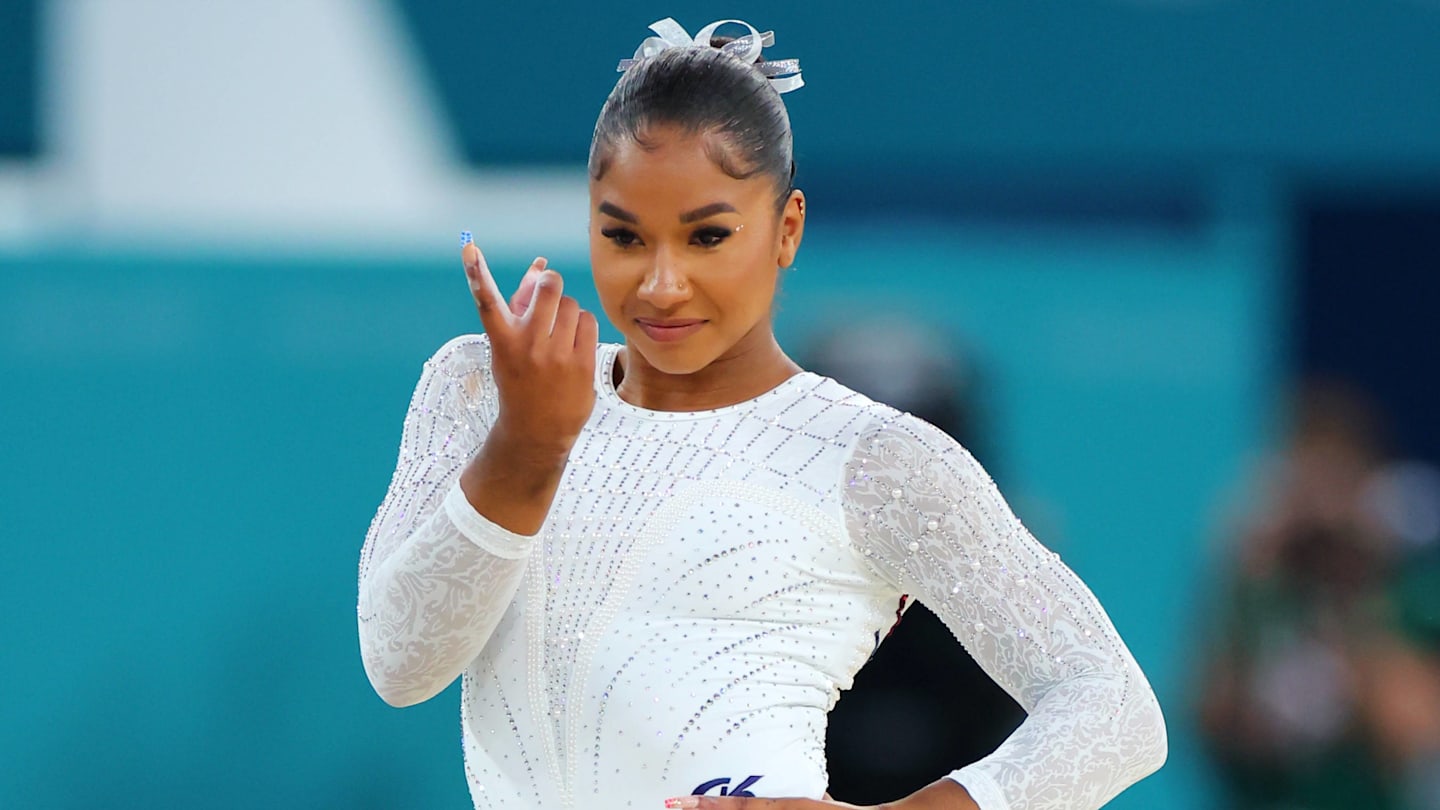 Jordan Chiles flexes gymnastics leap in unreal SI Swimsuit one-piece