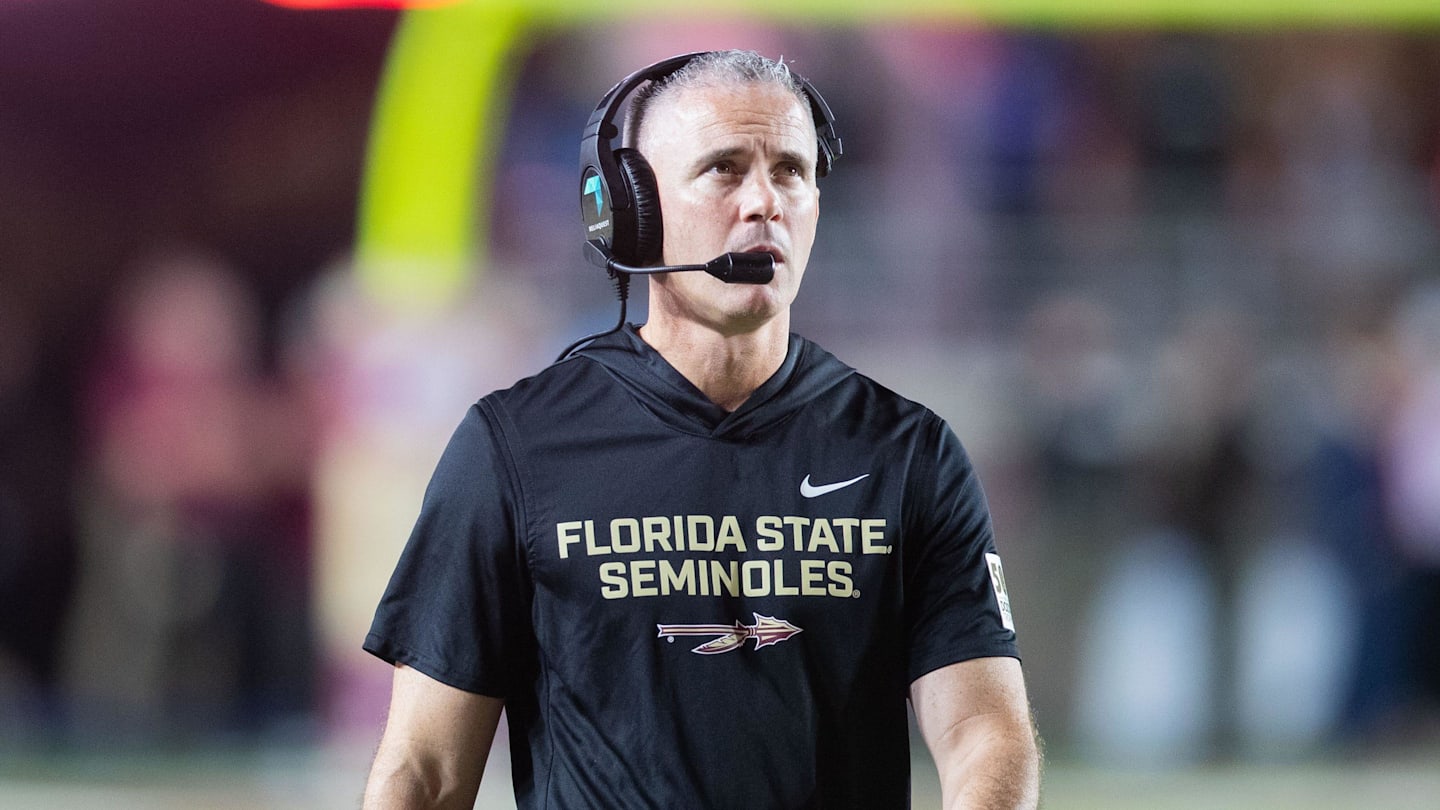 Mike Norvell addresses FSU's administration standing behind him during ...