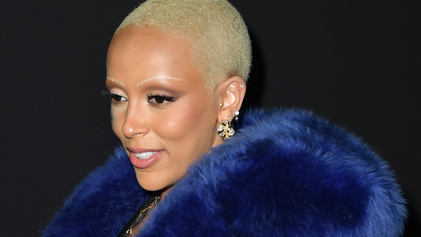 Doja Cat goes blue in the face while attending Monoto Paris Fashion Show