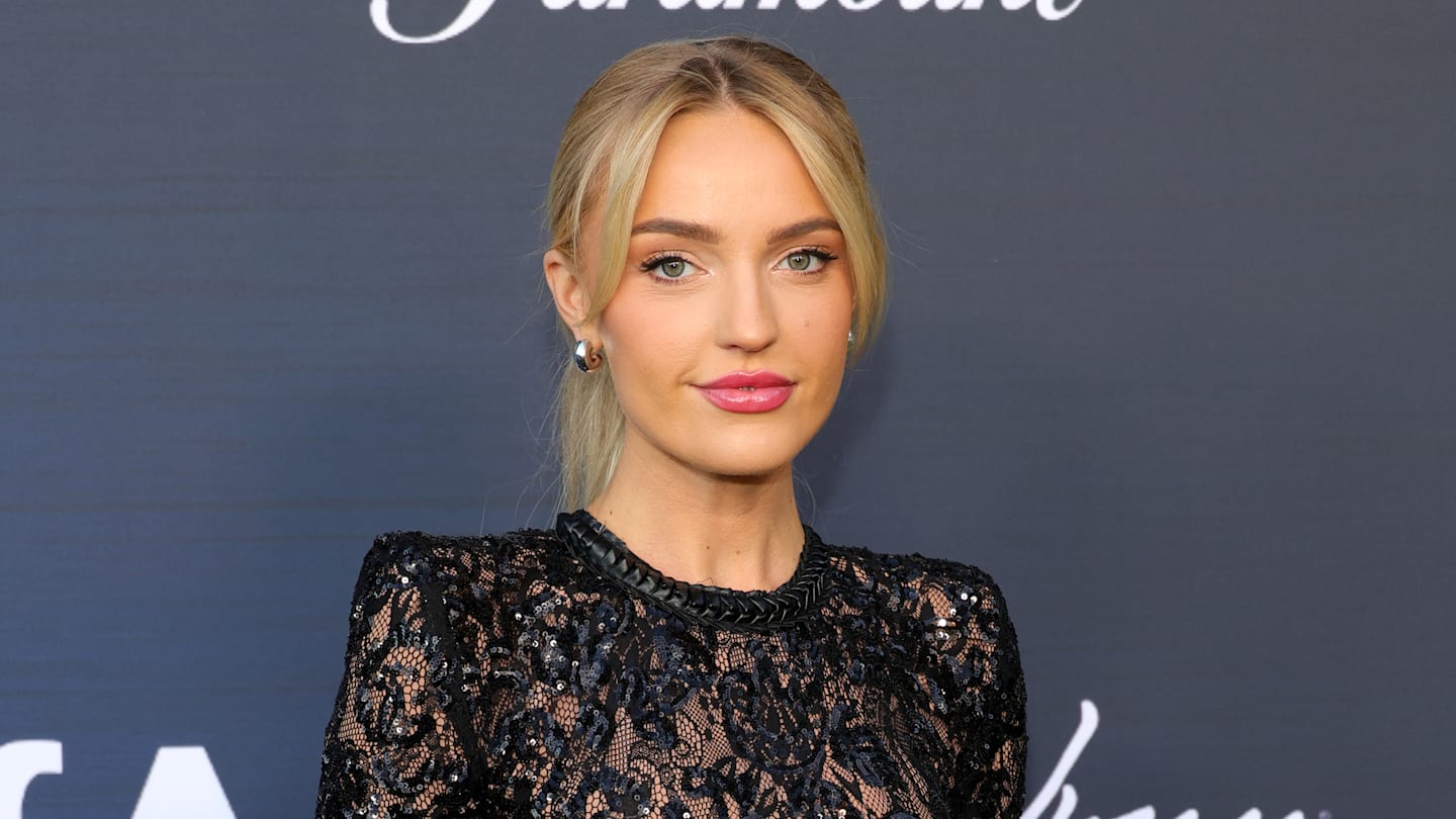 Morgan Riddle Is an ‘Aussie’ Holiday Dream in Backless Satin Ruby Gown