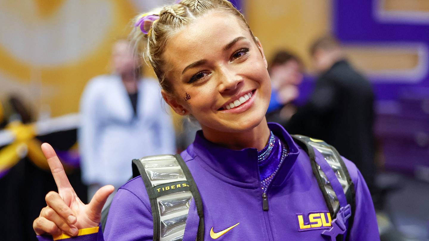 Livvy Dunne flexes LSU gymnastics casual fit in sporty white top, black ...