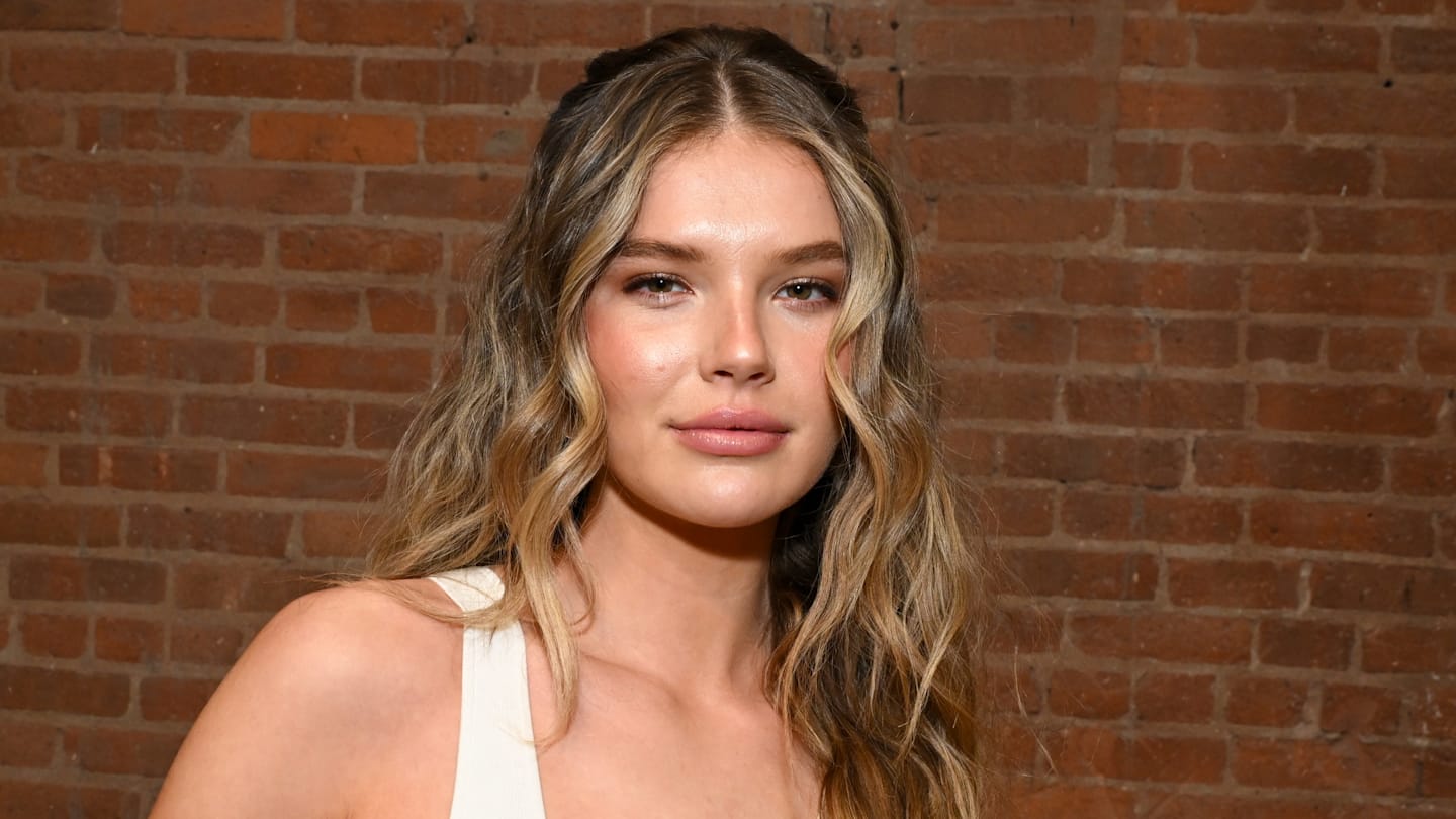 Ellie Thumann Pairs Sleek Blazer Mini Dress With Fabulous Pamela Anderson Bun