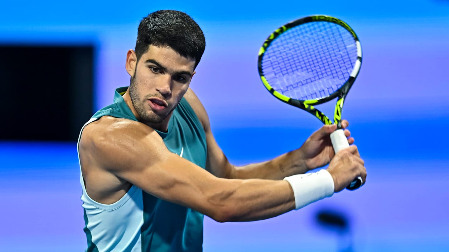 Carlos Alcaraz adjusts his racket before Indian Wells