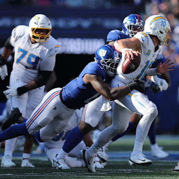 Rashawn Slater reports to Chargers media day amid contract buzz