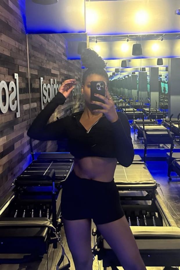 Taylor Rooks dresses down in black crop top, workout gear