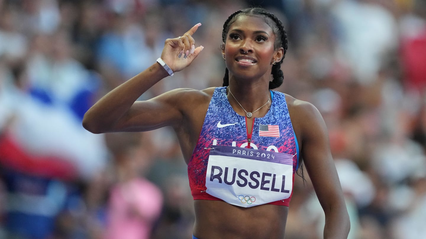 Olympic champ Masai Russell flexes gold medal with Rolls Royce ...