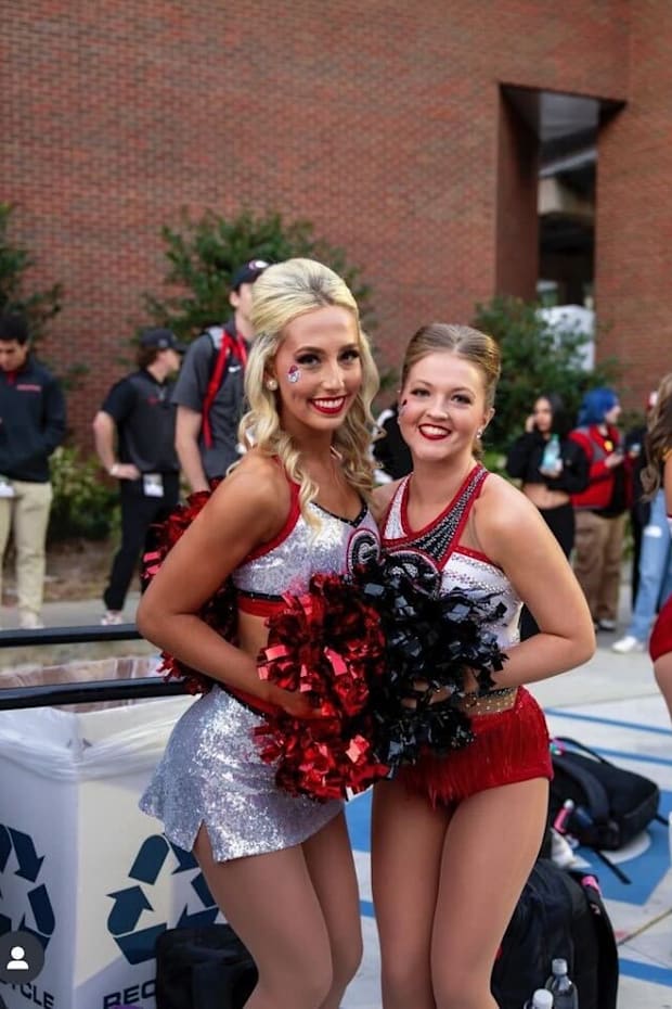 Carson Beck’s sister Kylie poses with another Georgia cheerleader