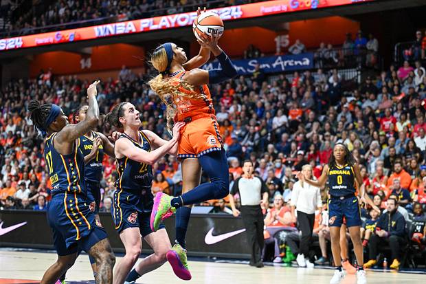 DiJonai Carrington brings the heat in fire all-red WNBA Playoff fit