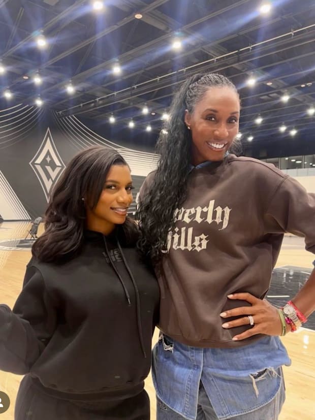 5-foot-9 Taylor Rooks looks tiny beside WNBA legend