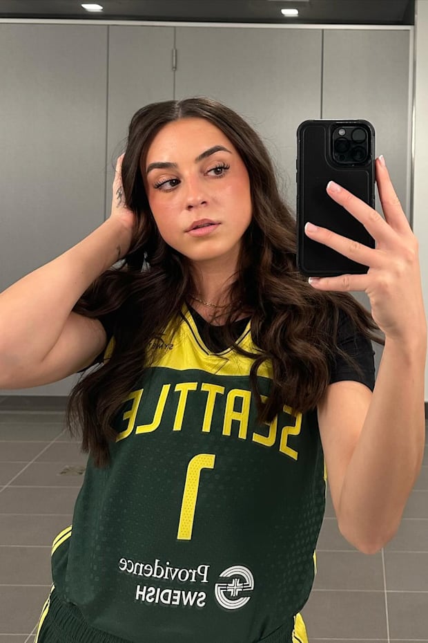 Nika Muhl shimmers in stunning low-cut power suit for WNBA Playoff fit