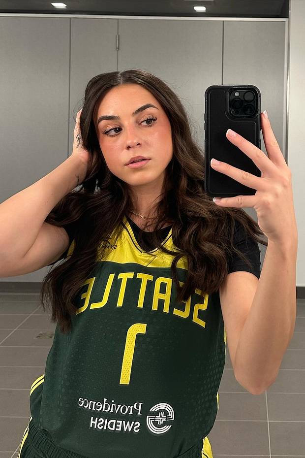 Nika Muhl struts in low-cut blazer, miniskirt business suit WNBA stunner