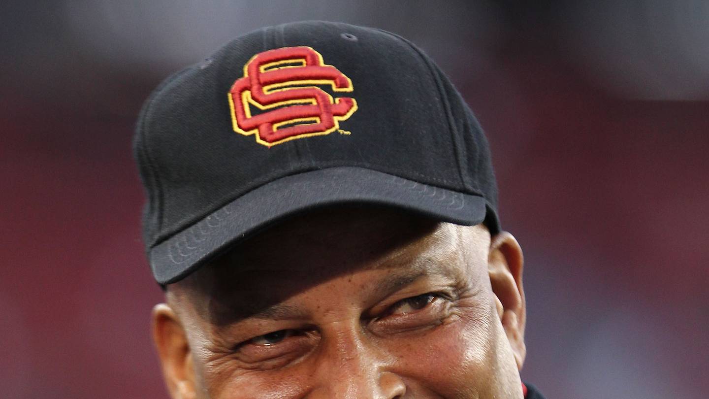 Jahkeem Stewart speaks with Ronnie Lott during USC football practice