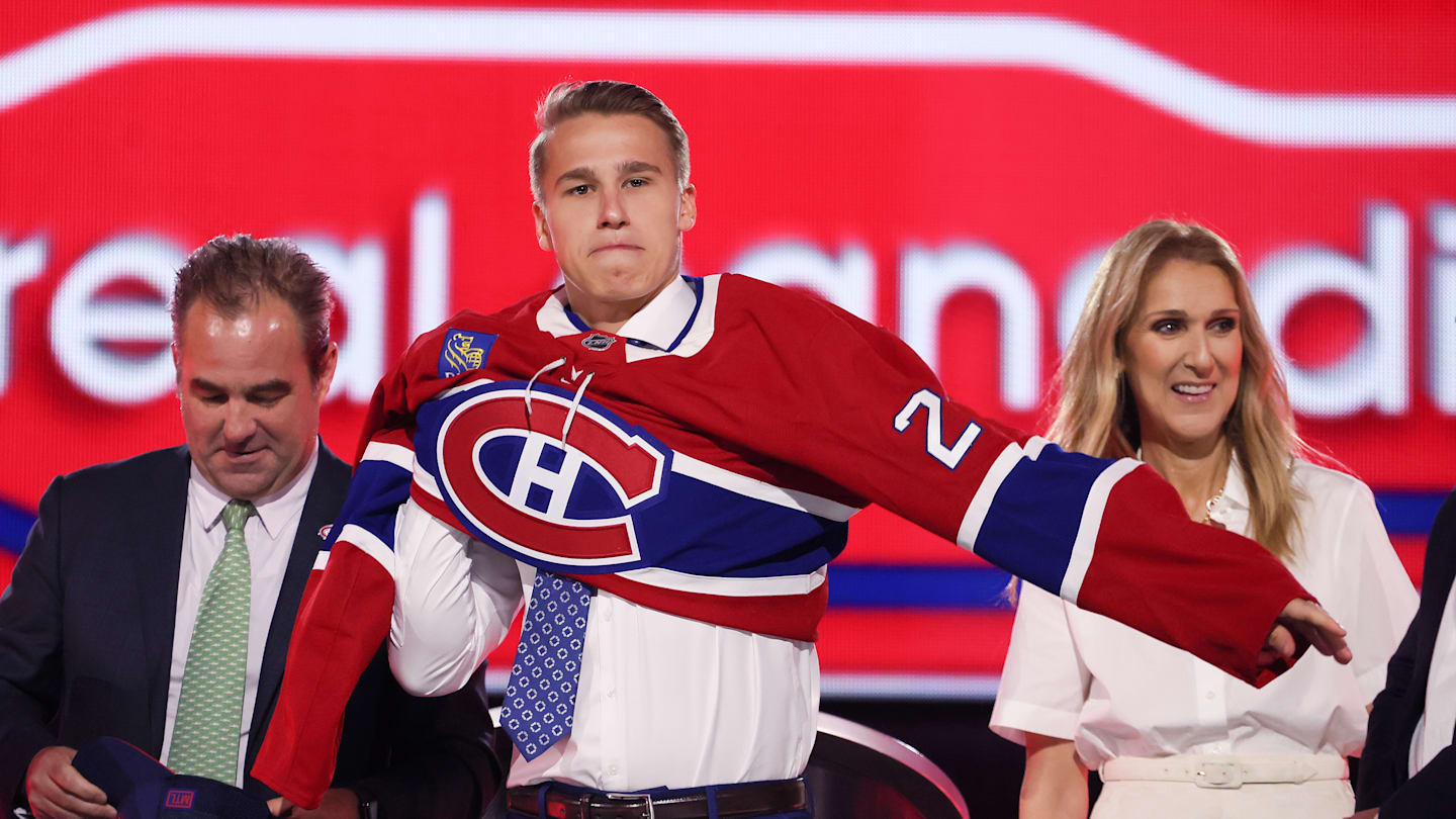 Kent Hughes shared a joke with Ivan Demidov at the draft