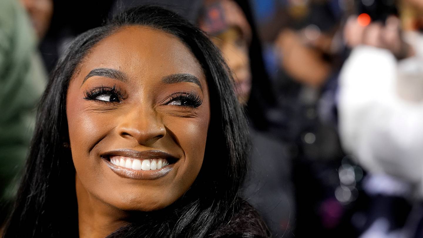 Simone Biles Brings Custom Fur Outerwear to Game Day in Chic Chocolate Coat