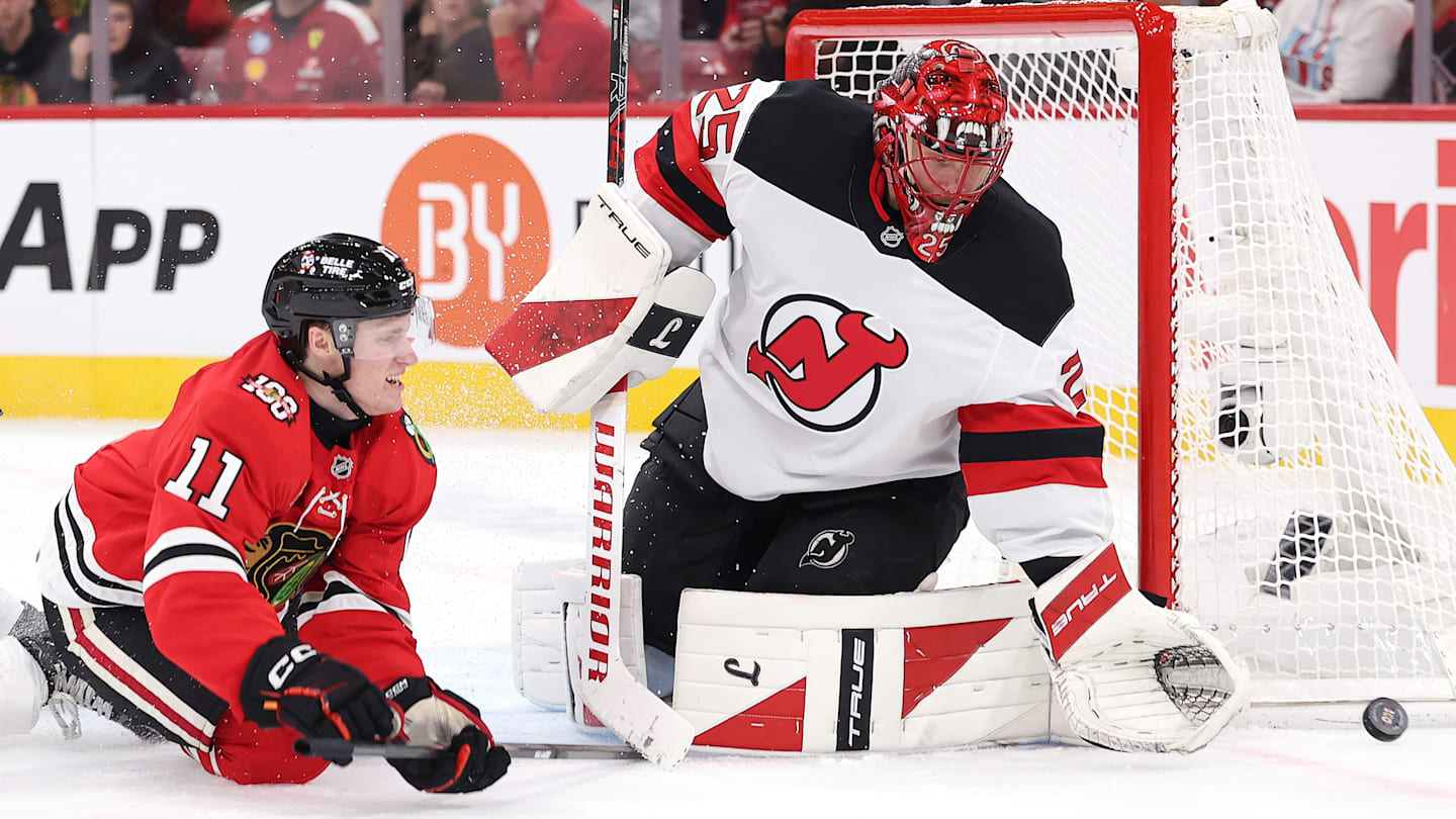 Shorthanded Blackhawks find a way to earn a point in overtime loss to ...