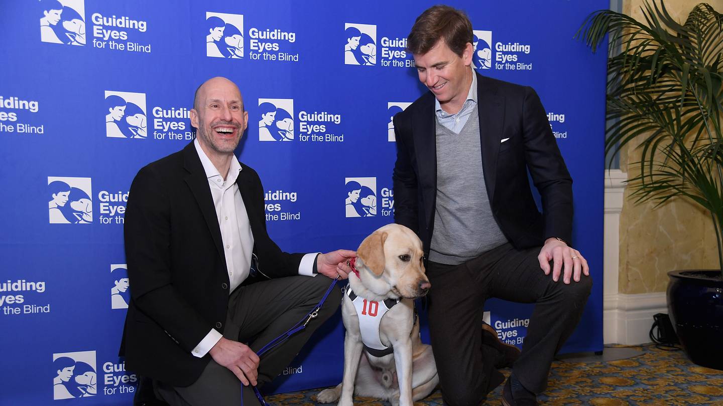 Eli Manning presents new guide dog for the blind, Ten, at emotional ...