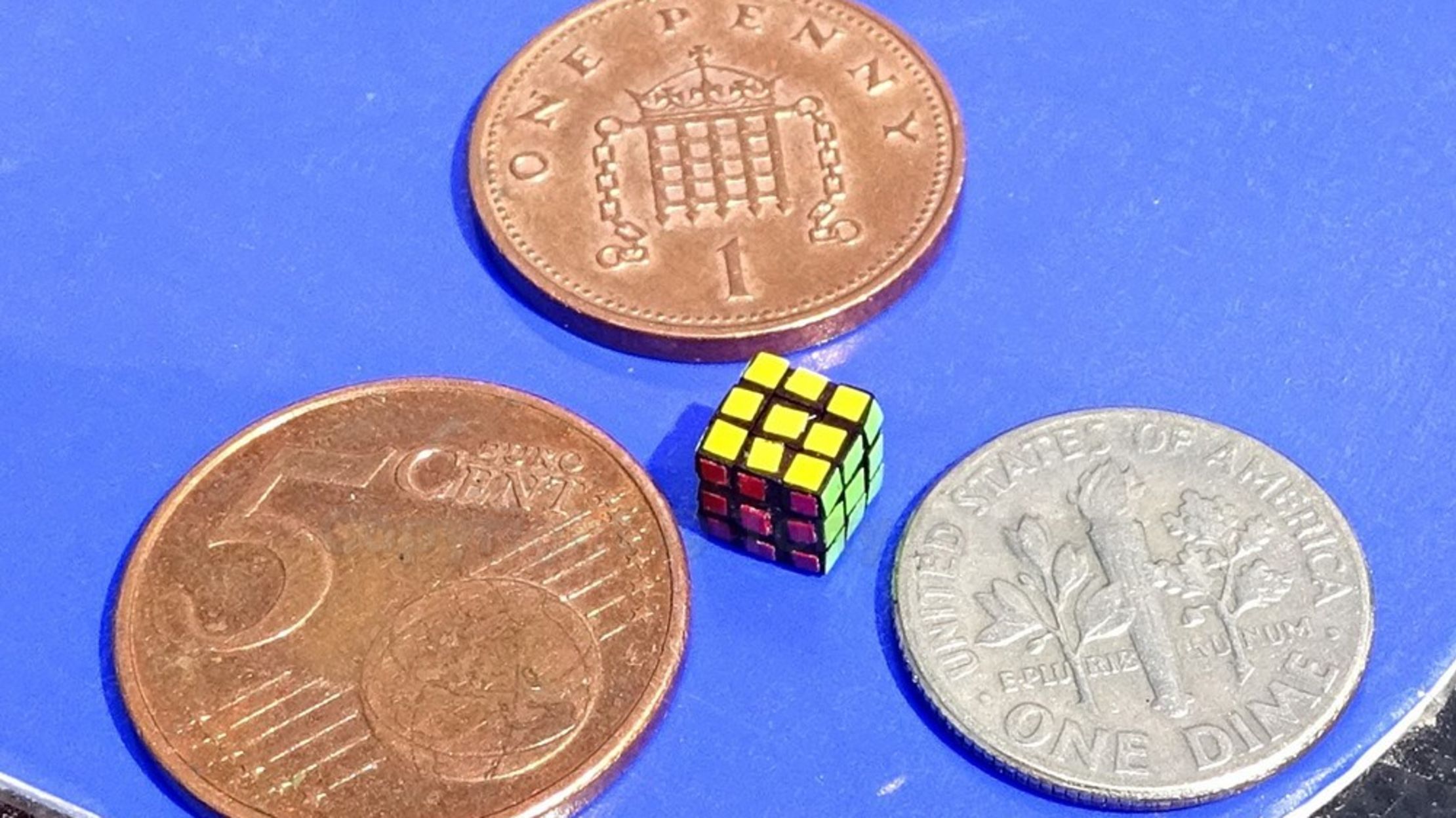 This Tiny Toy Could Be The World s Smallest Rubik s Cube Mental Floss this-tiny-toy-could-be-the-world-s-smallest-rubik-s-cube-mental-floss