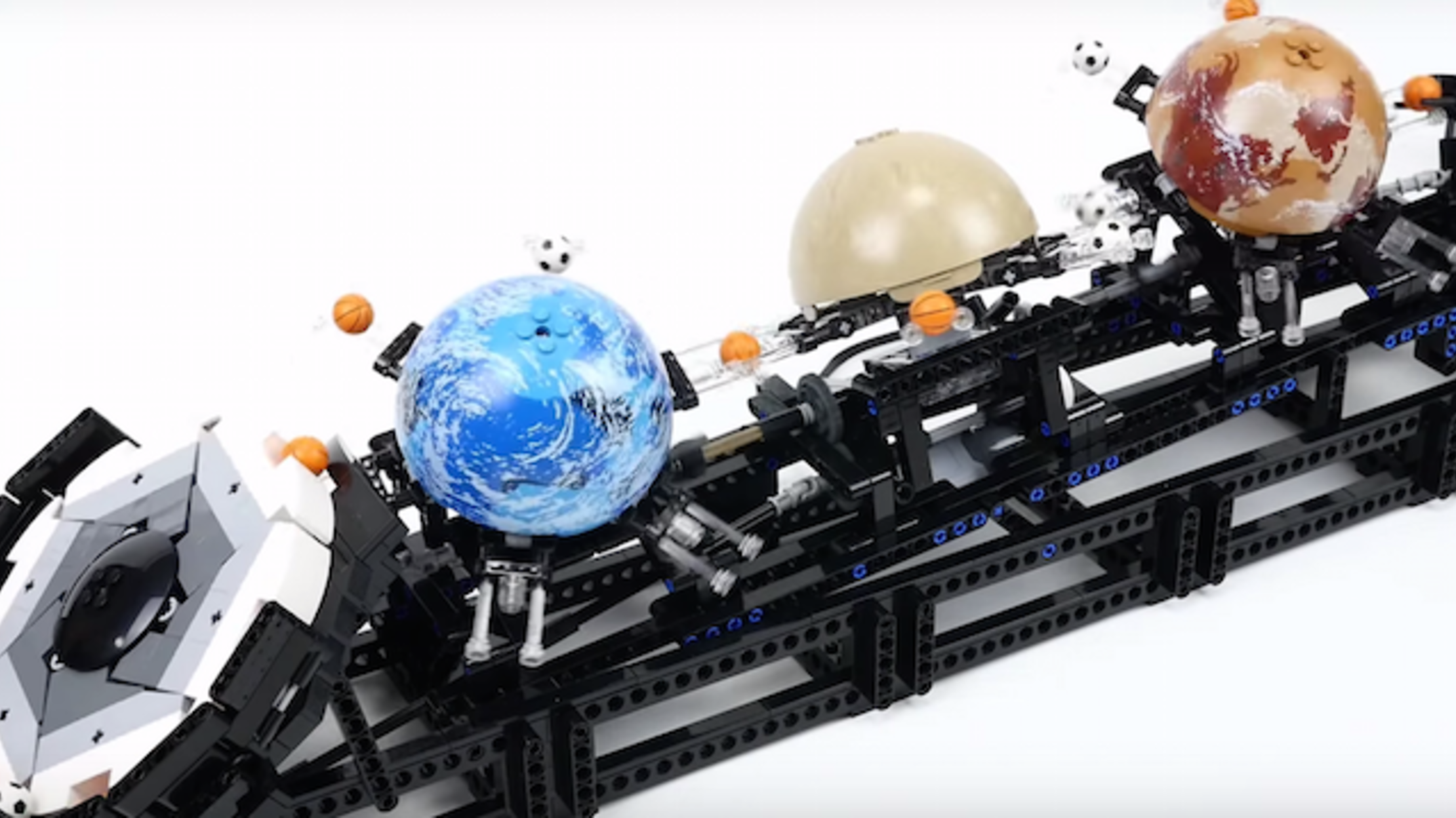 A LEGO Contraption That Sets Planets and Moons in Motion | Mental Floss