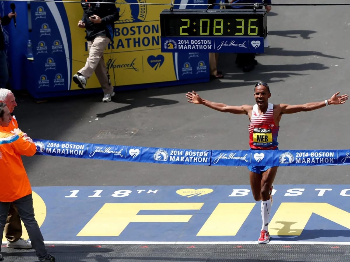 why do runners lean forward at finish line