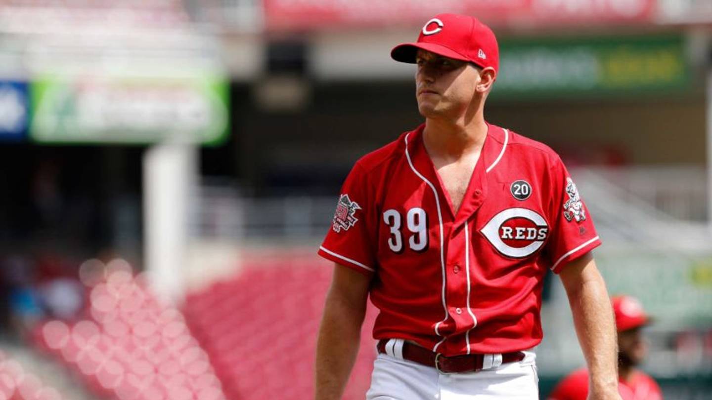 Reds pitcher Lucas Sims and his wife reward the Nacho Man after fall