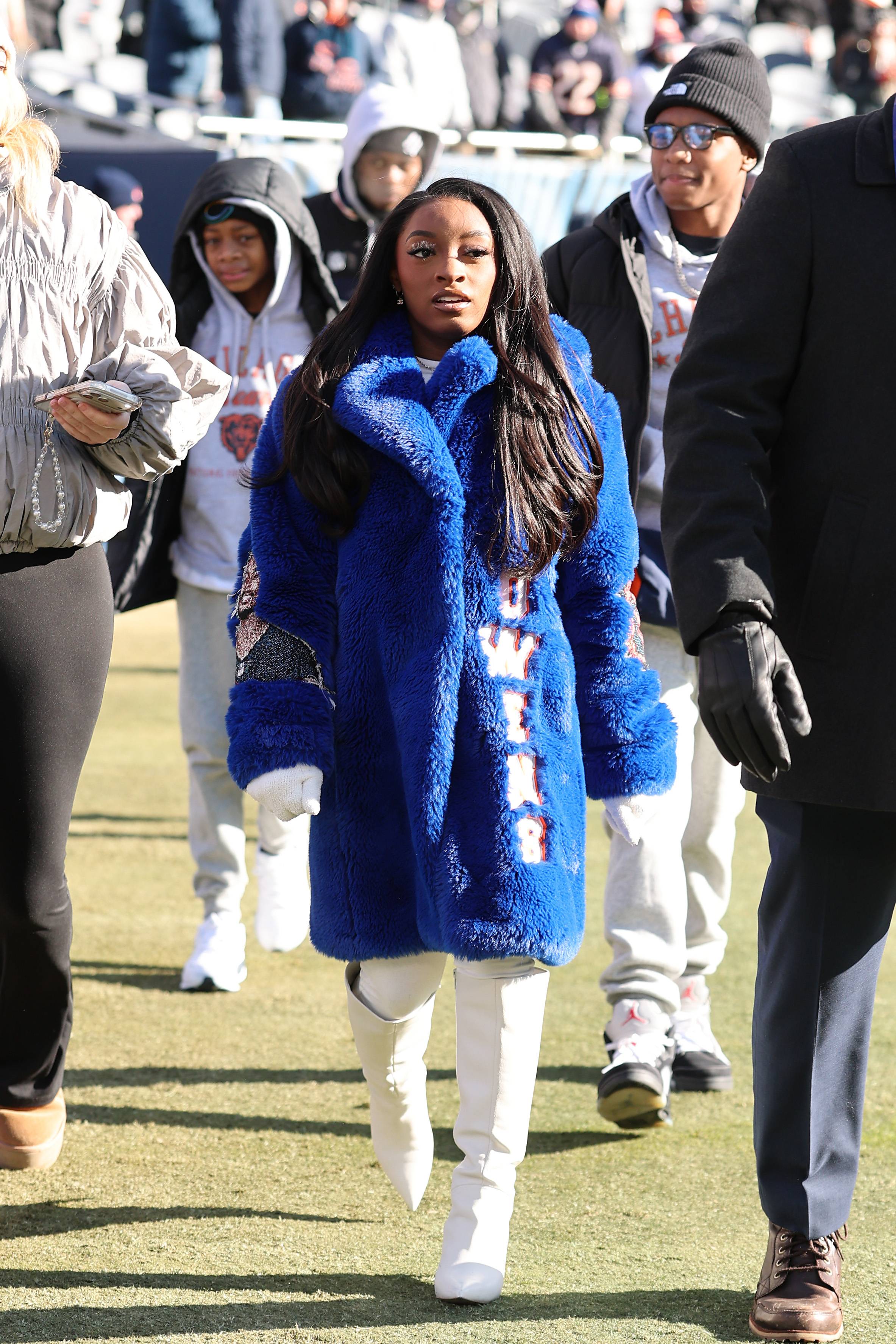 Simone Biles Rocks Custom Fur Coat While Cheering on Husband Jonathan Owens