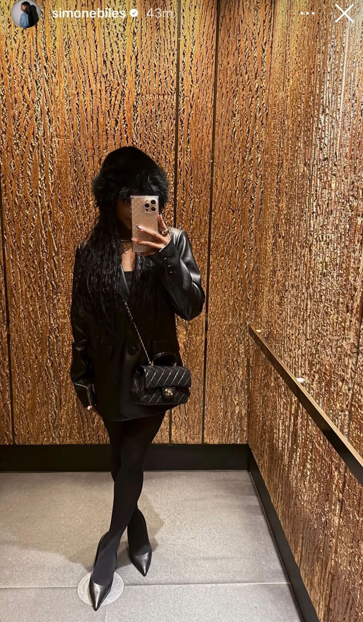 Simone Biles seduces in all-black furry fit for elevator selfie