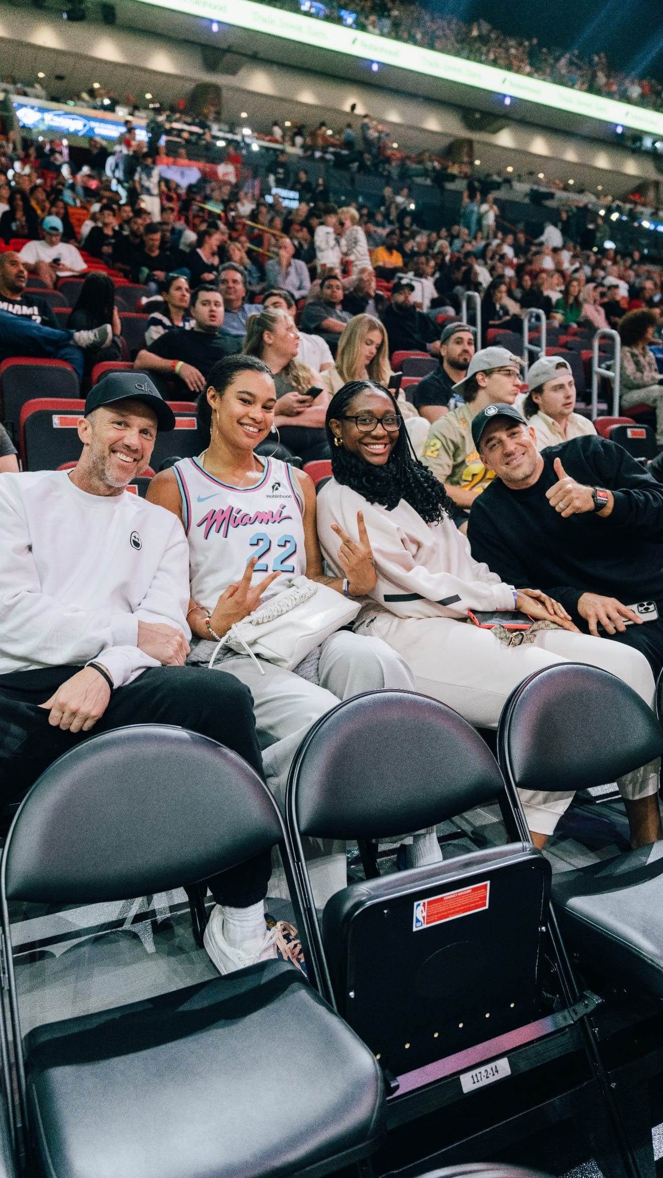 WNBA's Satou Sabally links with Jimmy Butler, rocks jersey courtside at ...
