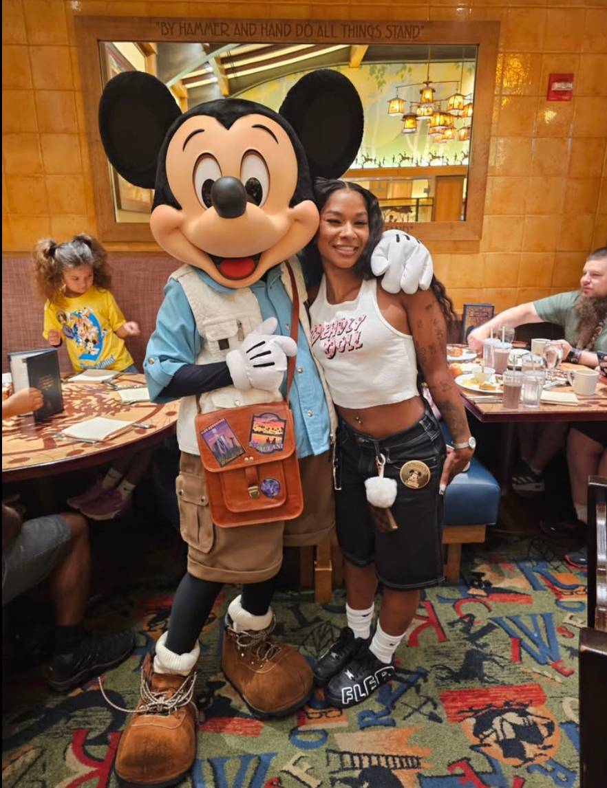 4-foot-11 Jordan Chiles towered over by giant Chewbacca at Disneyland ...